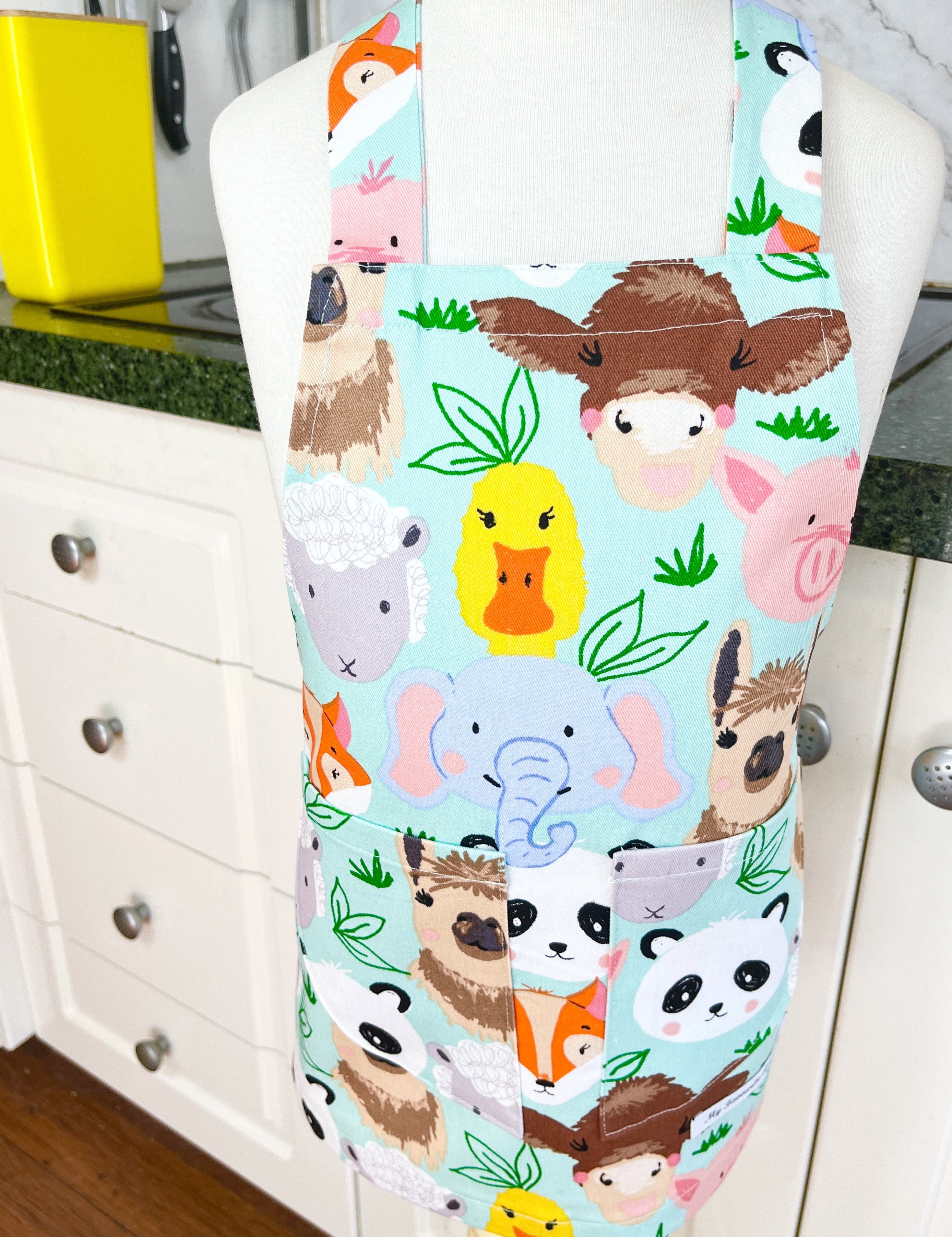 This Toddler's Apron is Covered in All Kinds of Cute Animals – My ...